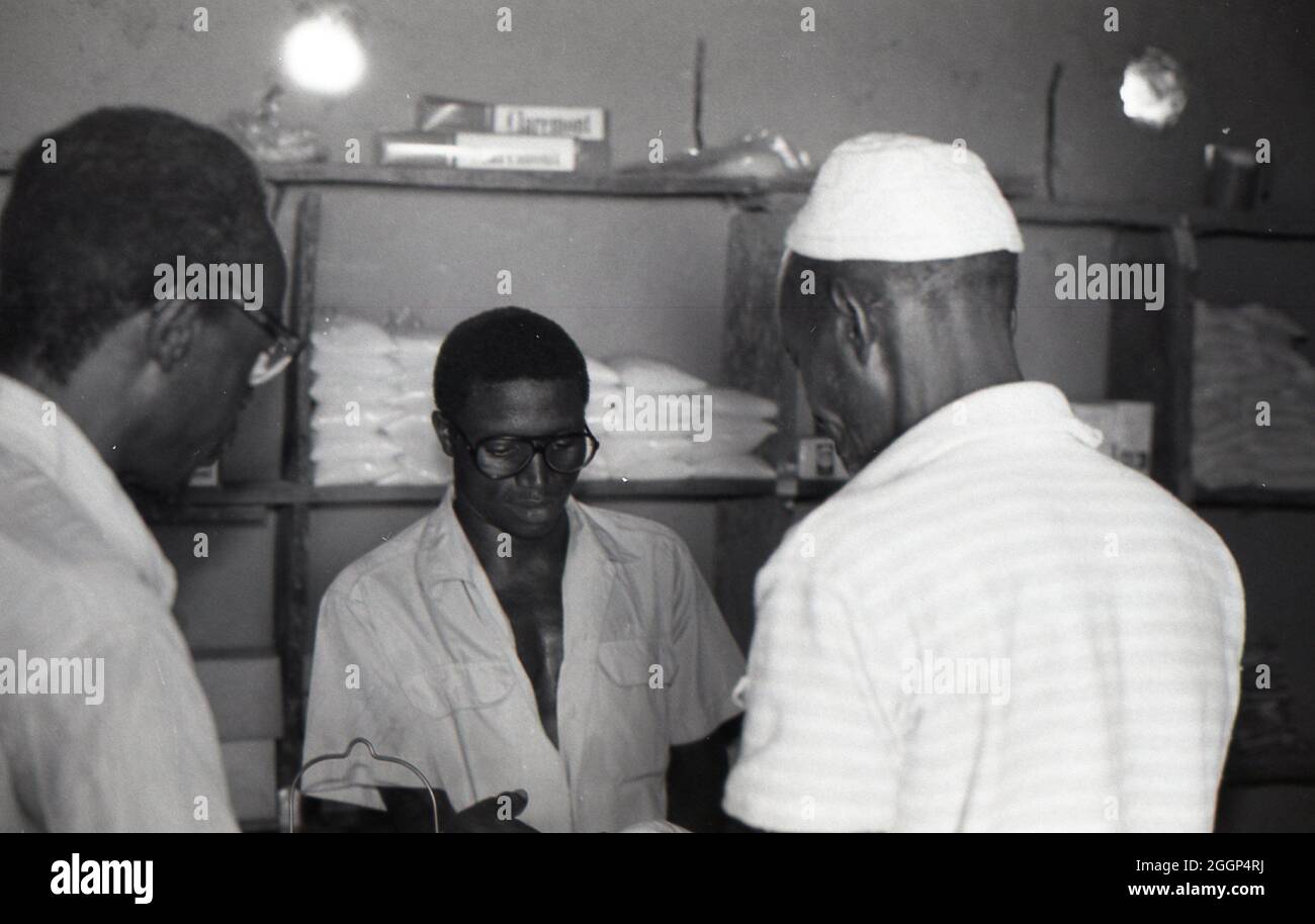 A group of men observing objects Stock Photo - Alamy