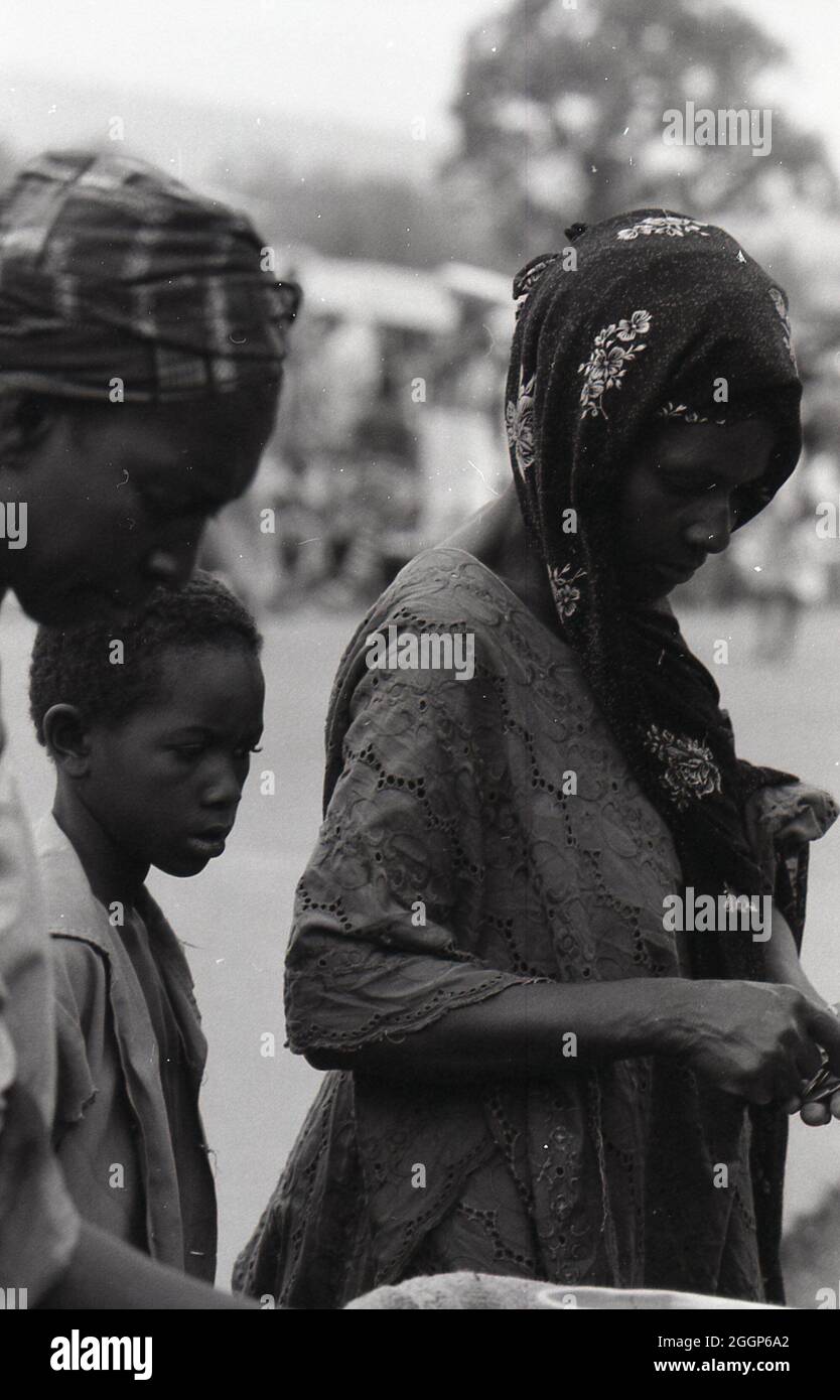A woman and children observing something Stock Photo - Alamy