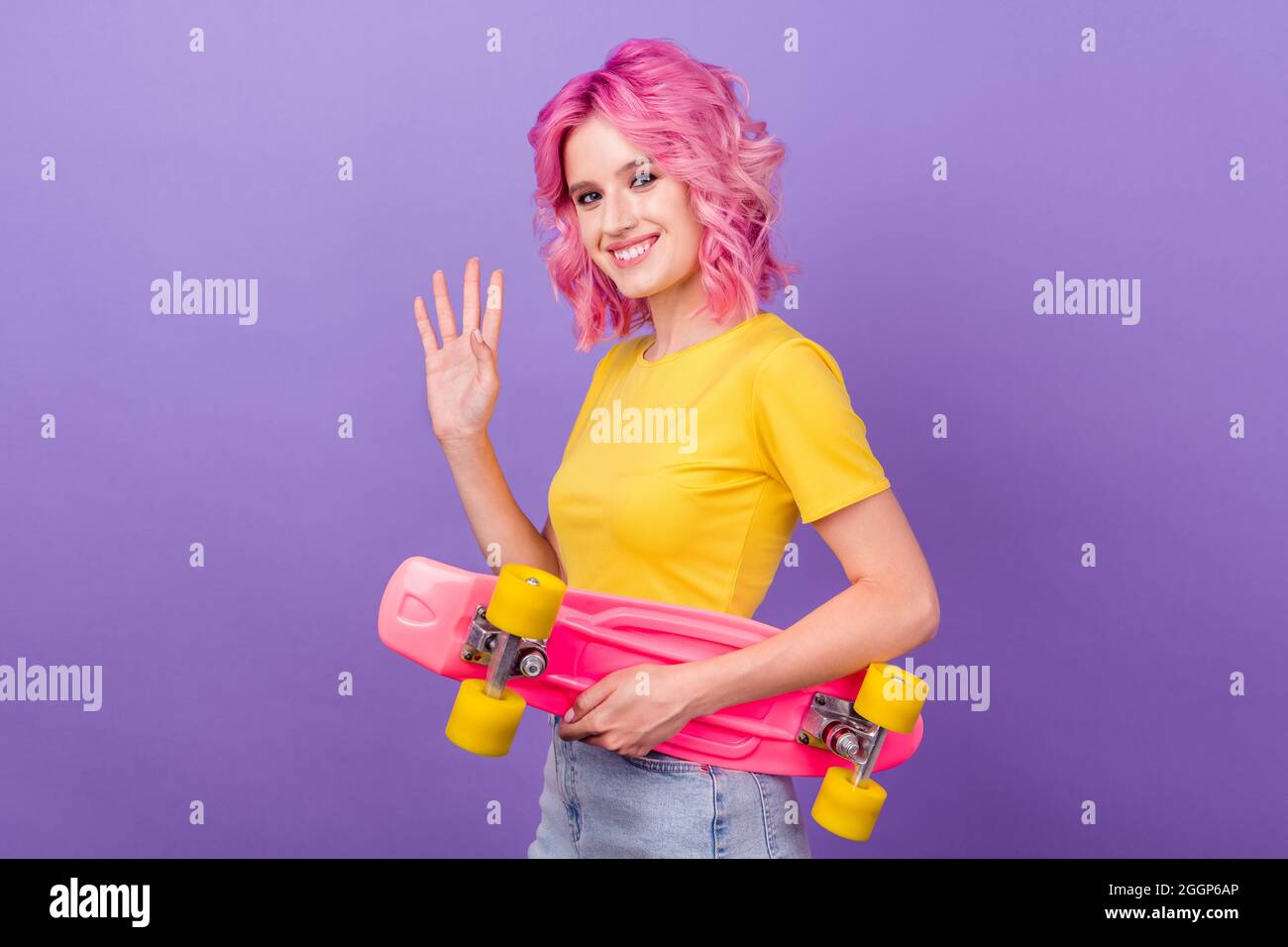 Photo of young girl happy positive smile waving hand hello hold ...