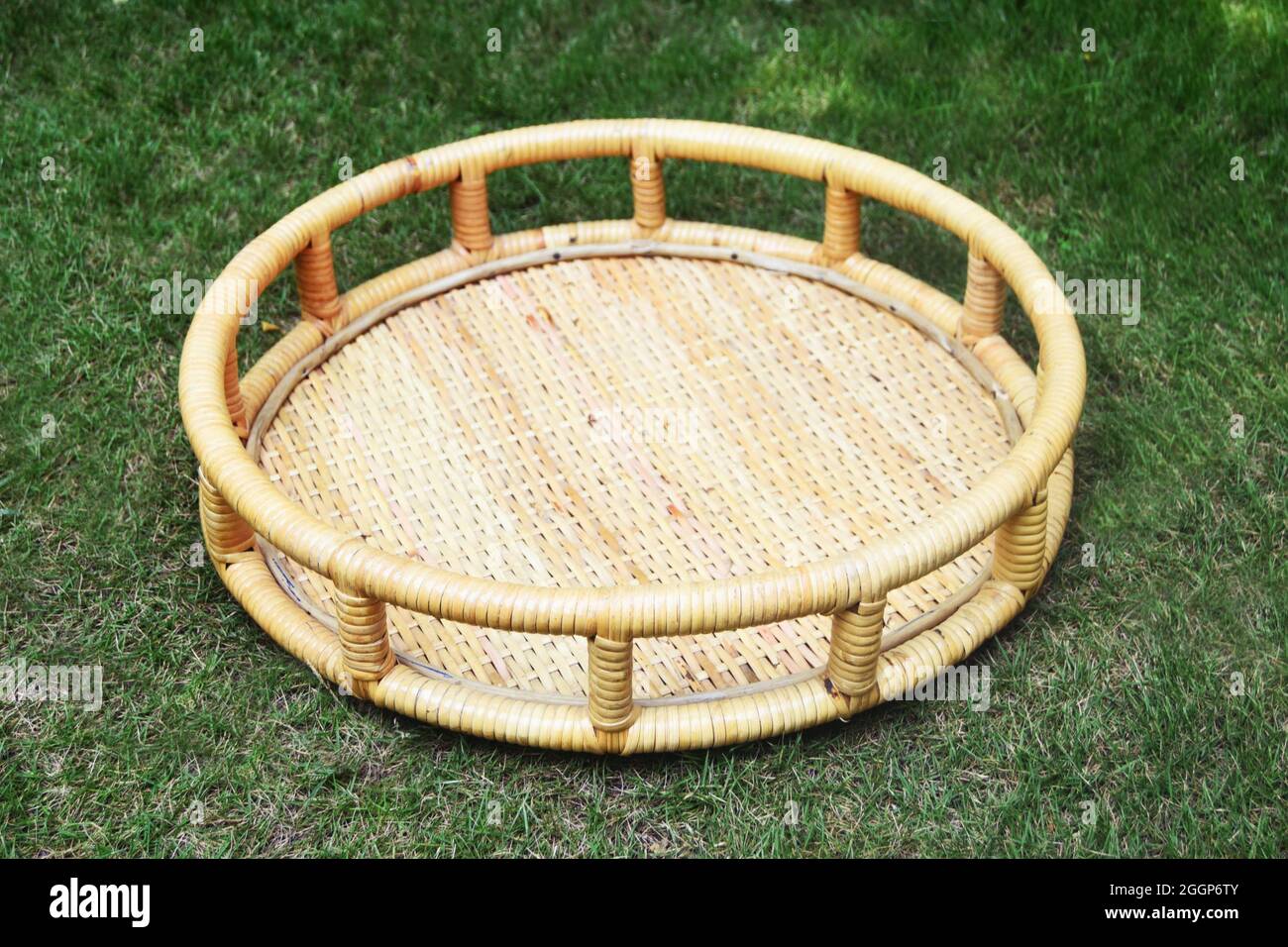 rattan cane gift basket with outdoor background selective soft focus ...