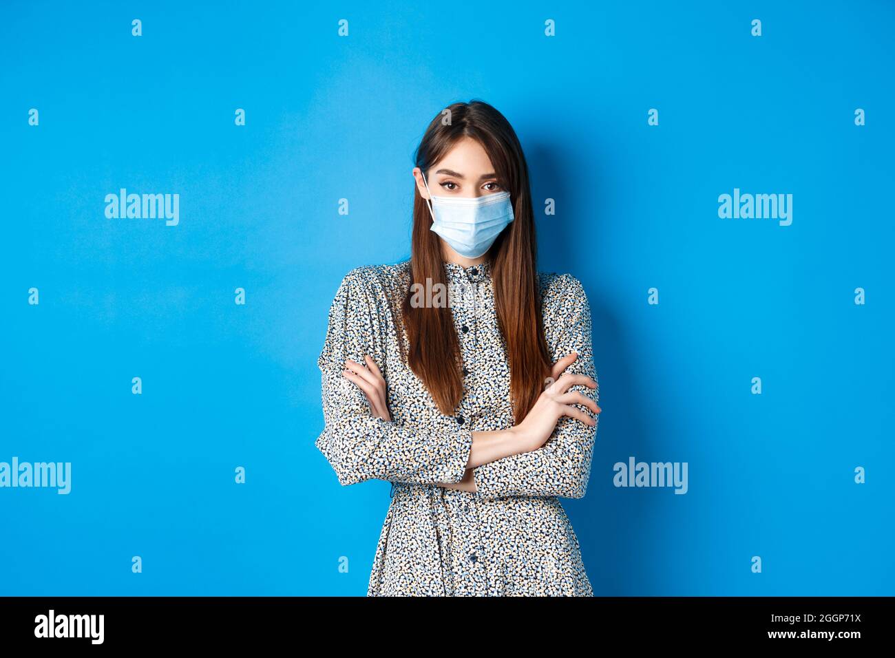 Covid-19, pandemic lifestyle concept. Serious young woman with long ...