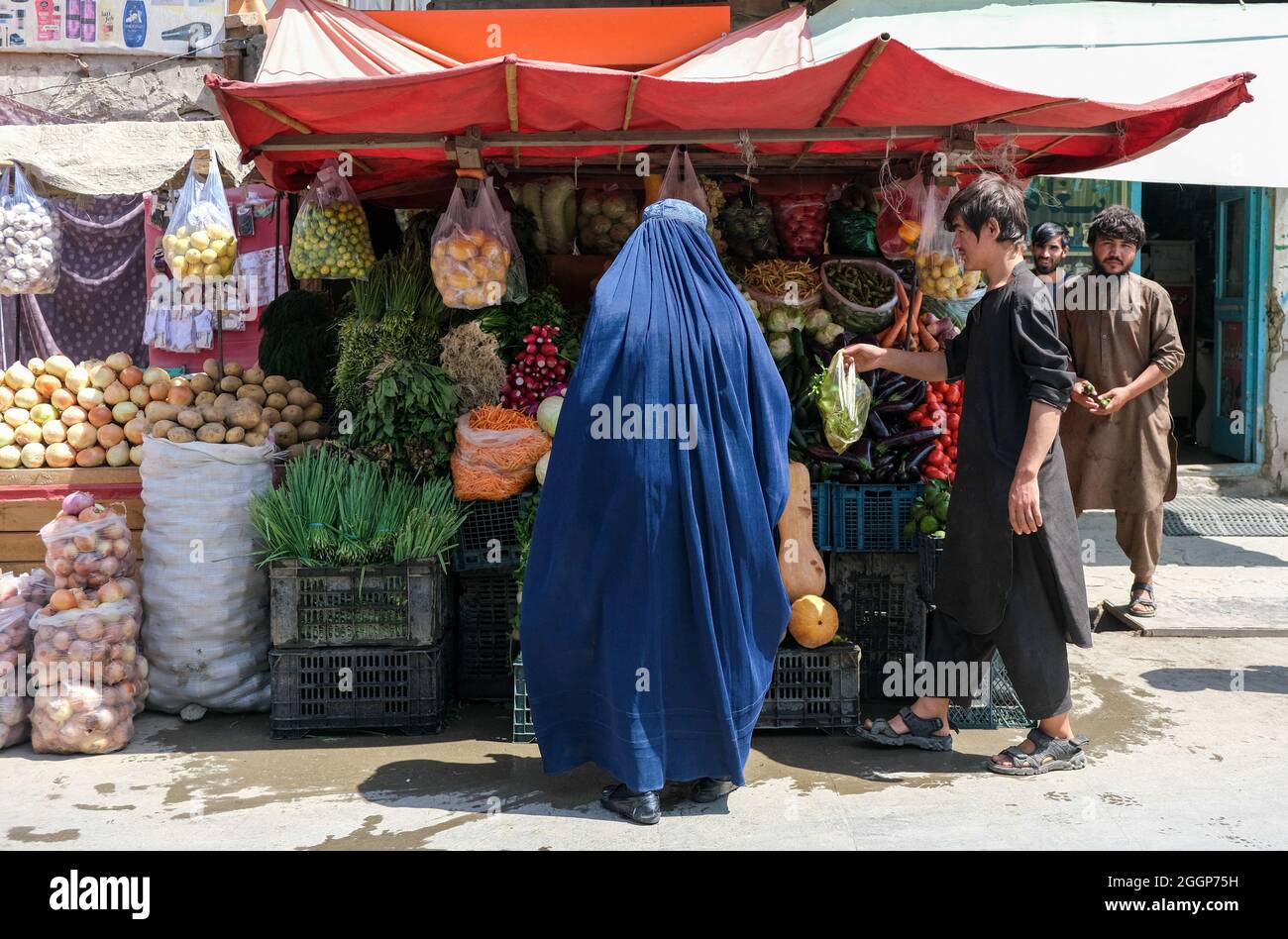 A view of a district bazaar as Afghan people shopping at a district ...