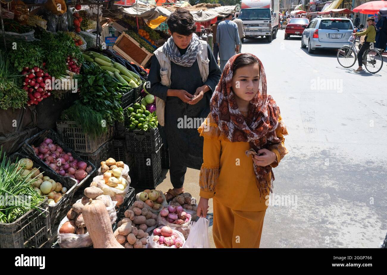 A view of a district bazaar as Afghan people shopping at a district bazaar, during their daily ...