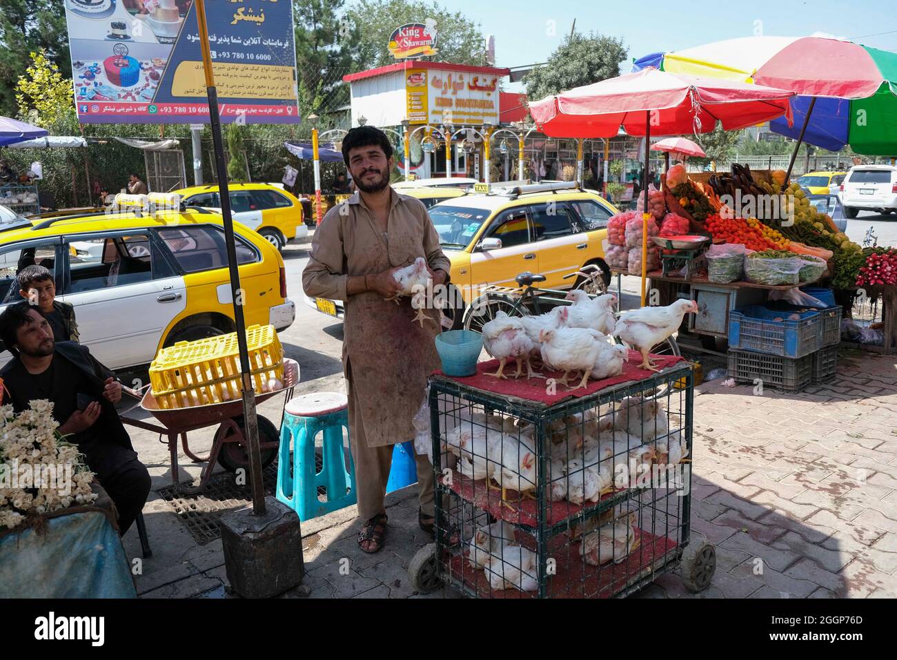 A view of a district bazaar as Afghan people shopping at a district bazaar, during their daily ...