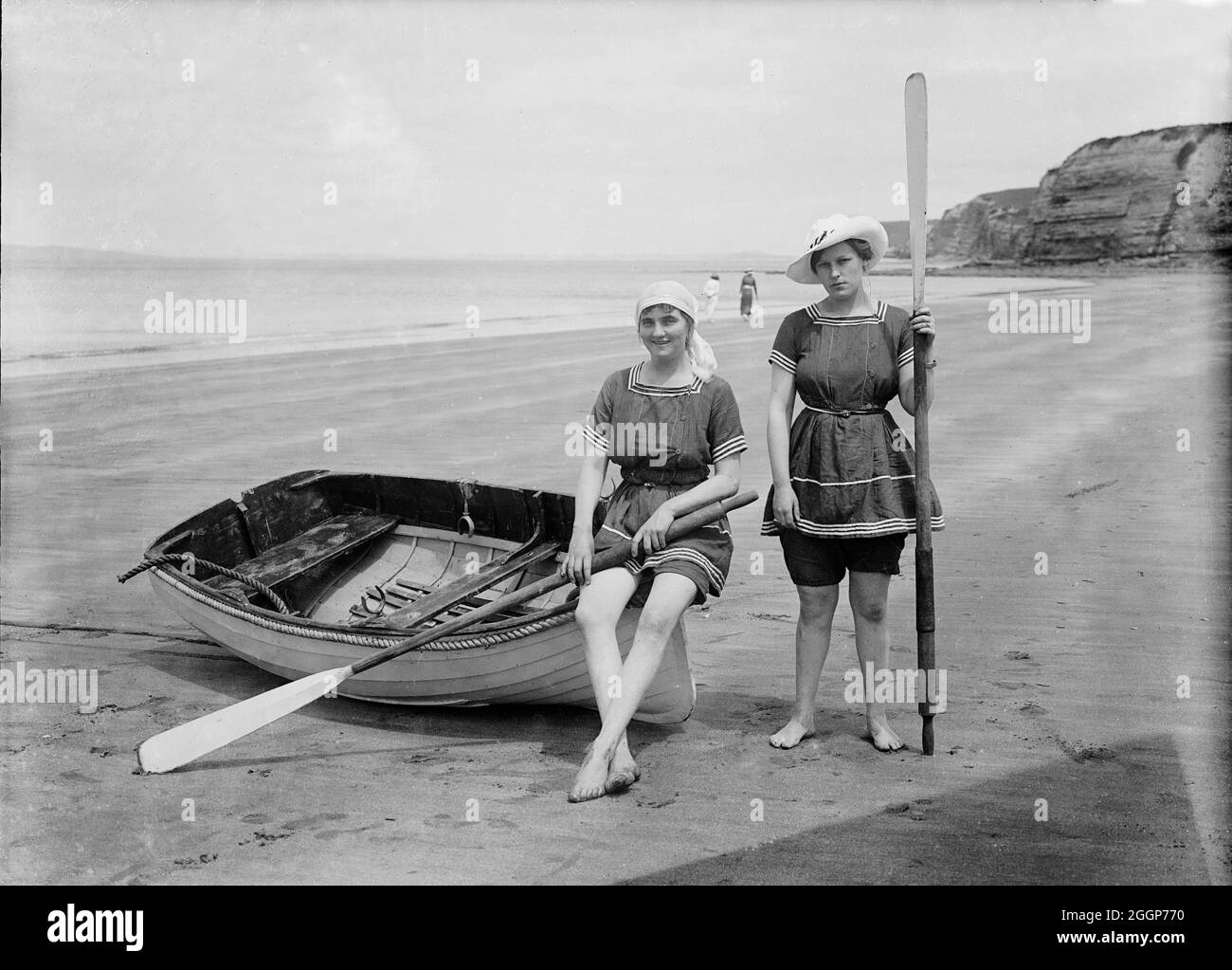 Two women in bathing costumes Stock Photo - Alamy