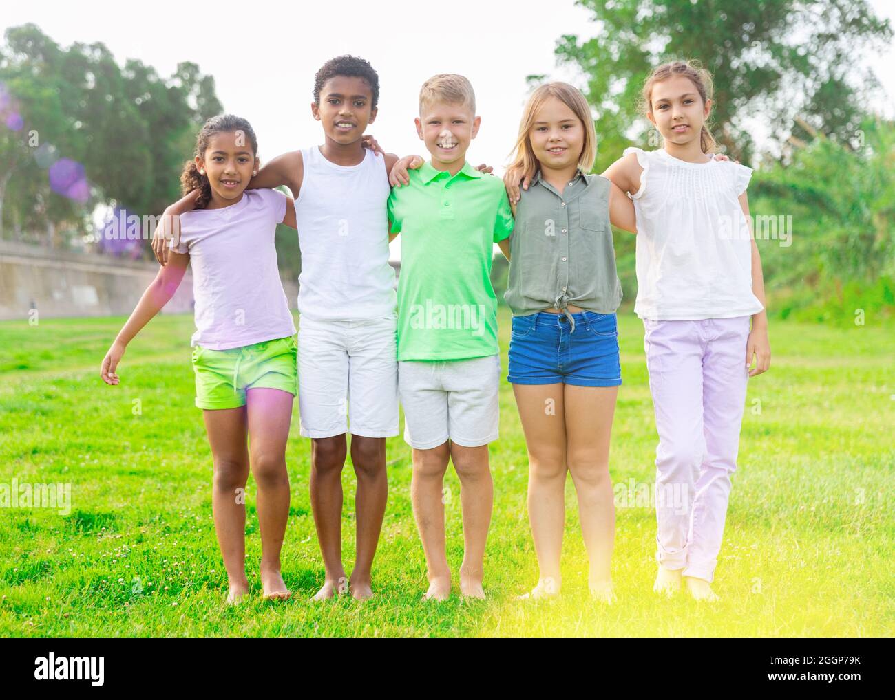 Group photo of kids on grass Stock Photo - Alamy