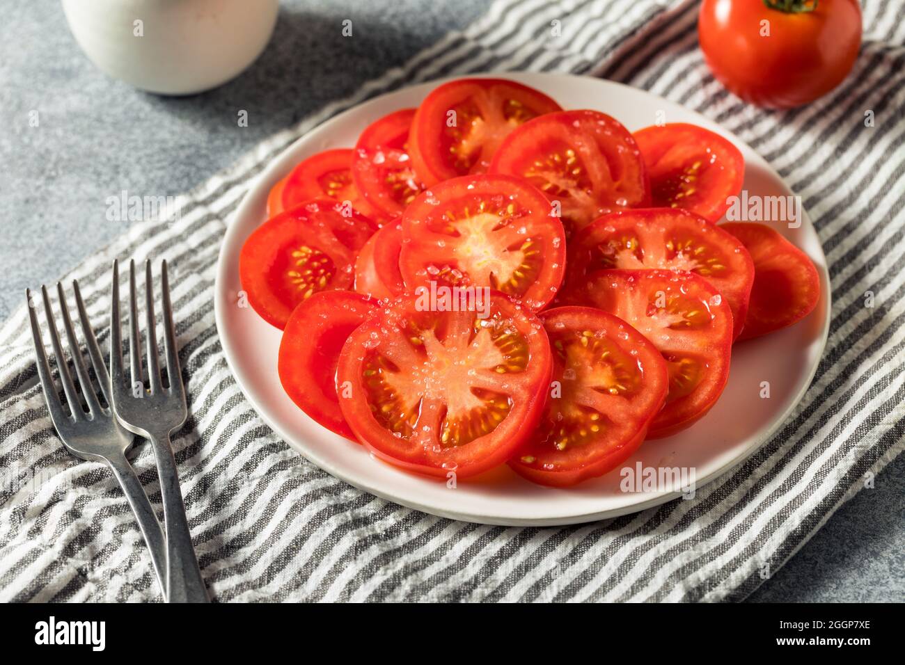 Healthy Organic Sliced Tomatoes with Salt Ready to Eat Stock Photo - Alamy