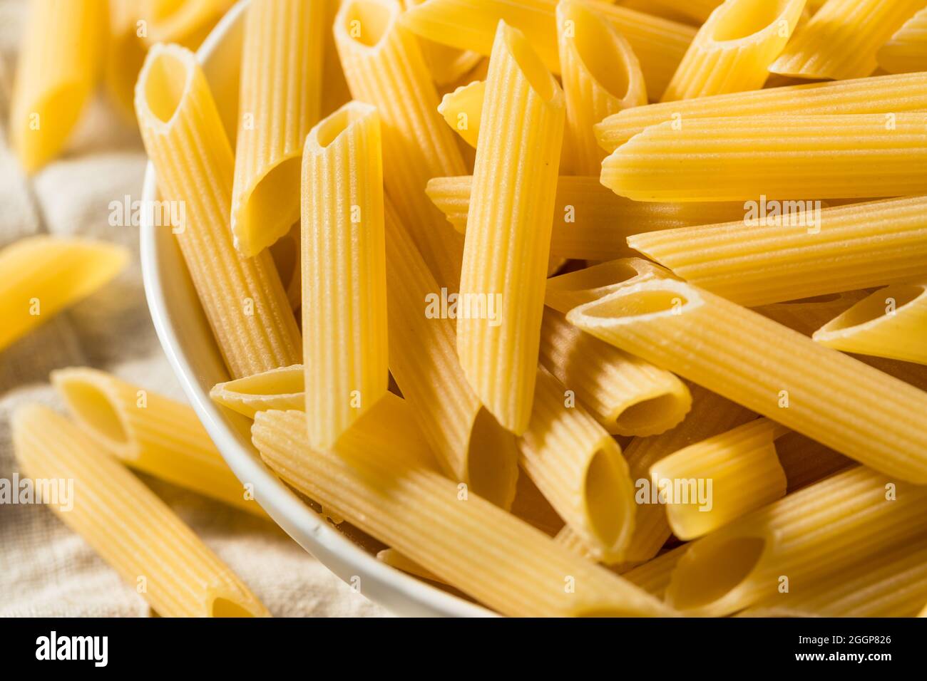 Homemade Raw Dry Penne Pasta in a Bowl Stock Photo - Alamy