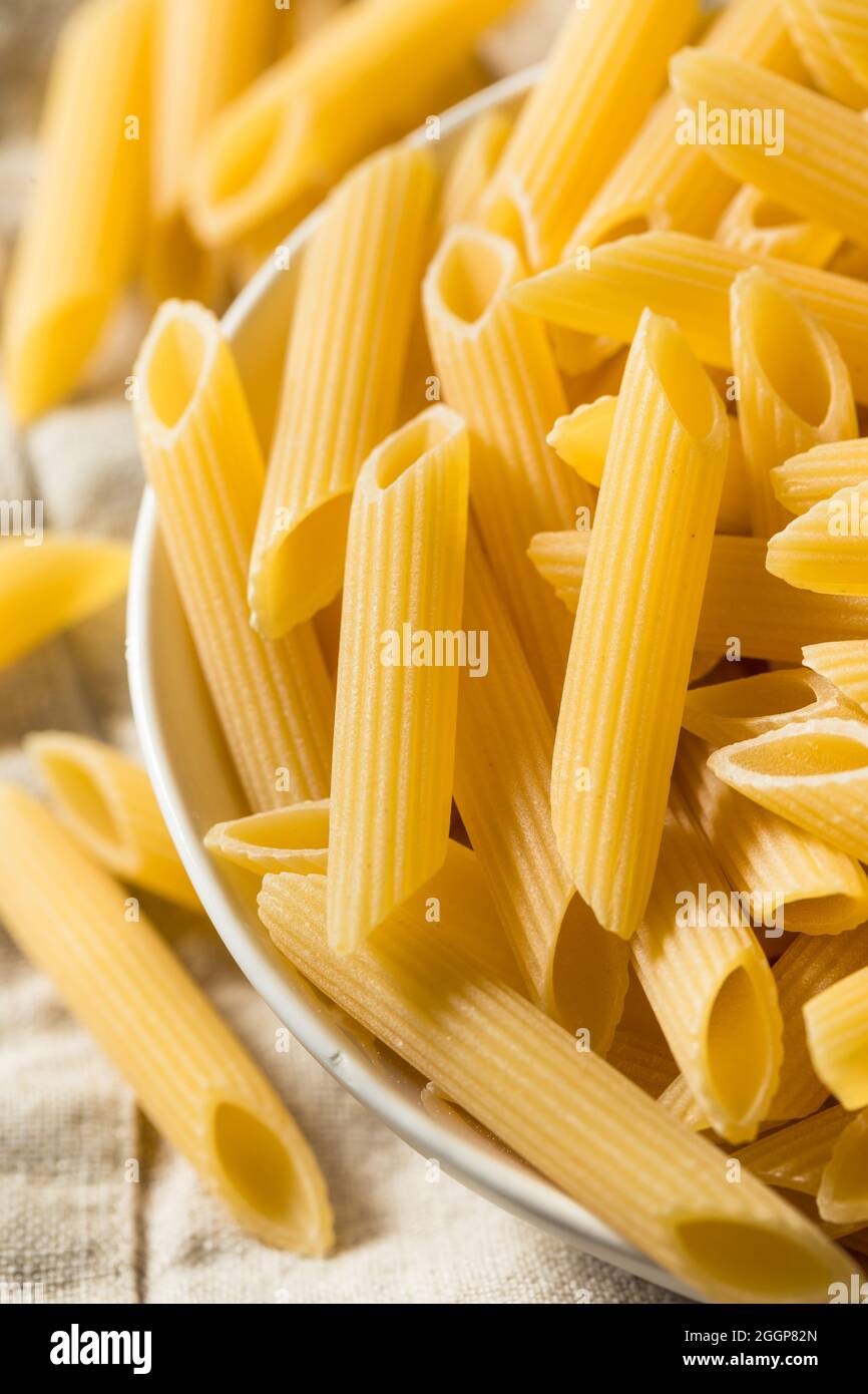 Homemade Raw Dry Penne Pasta in a Bowl Stock Photo - Alamy
