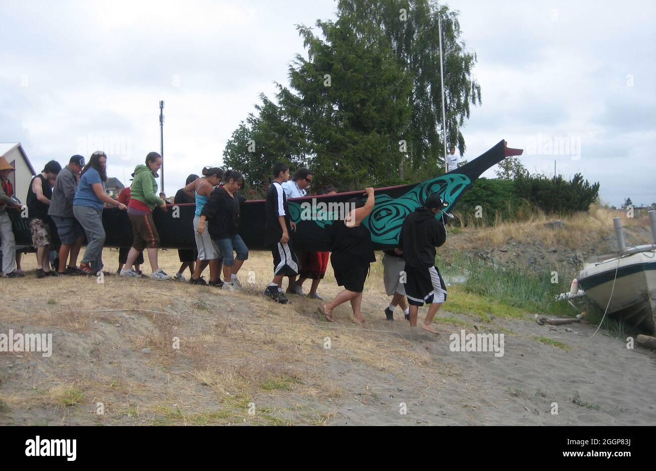 A canoe is launched at the beach at the Swinomish Tribal Community ...