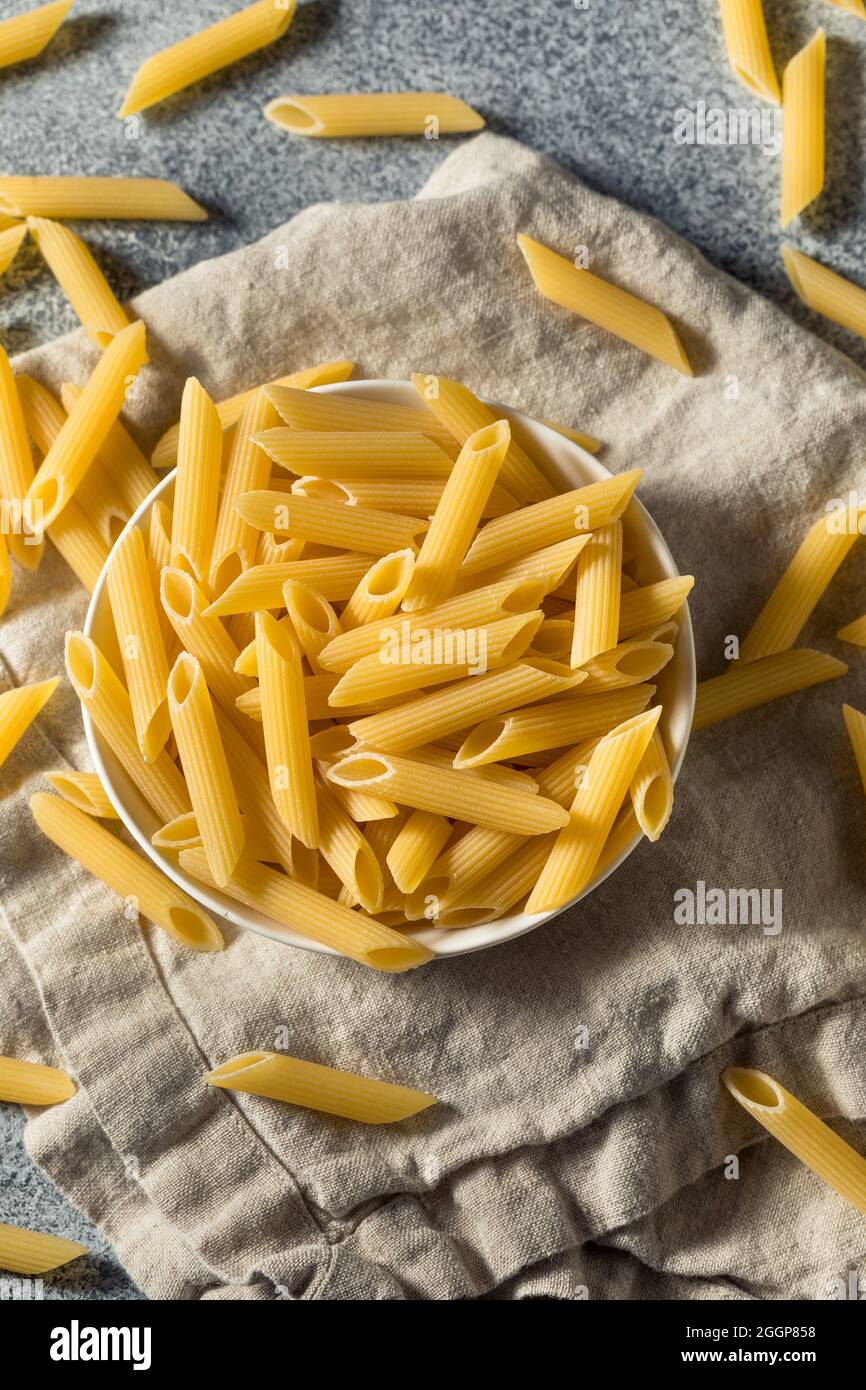 Homemade Raw Dry Penne Pasta in a Bowl Stock Photo - Alamy