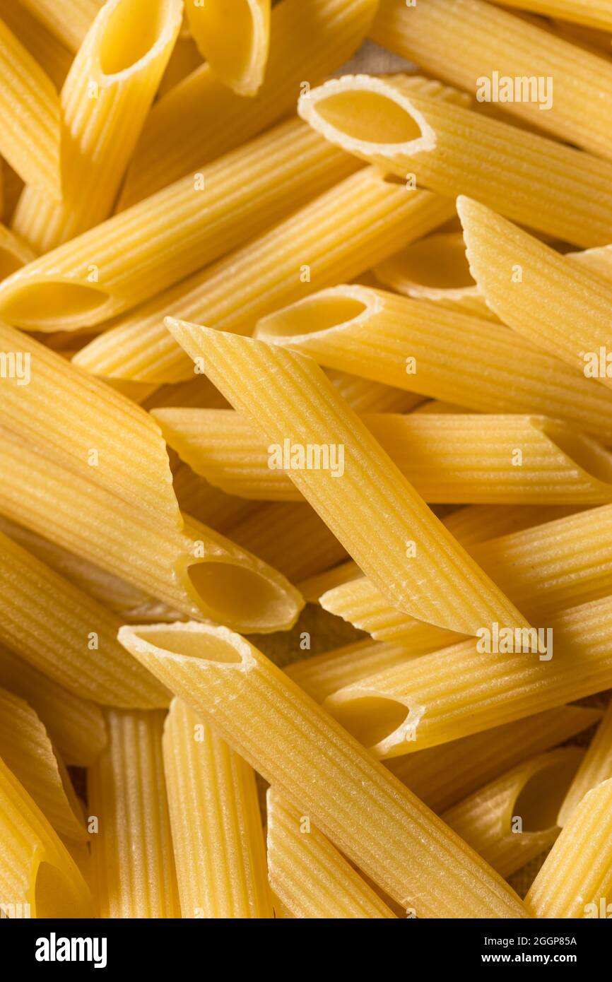 Homemade Raw Dry Penne Pasta in a Bowl Stock Photo - Alamy