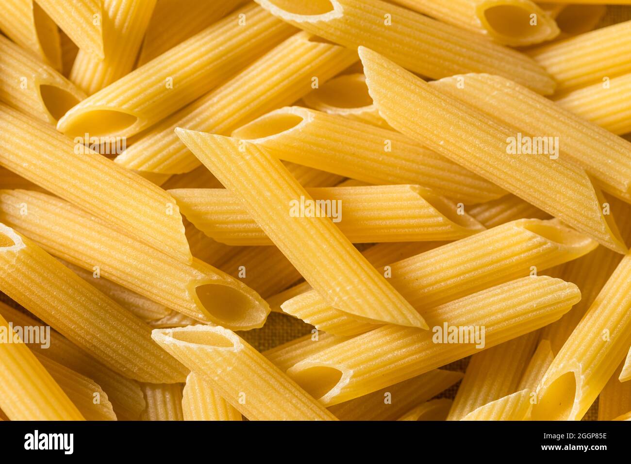 Homemade Raw Dry Penne Pasta in a Bowl Stock Photo - Alamy
