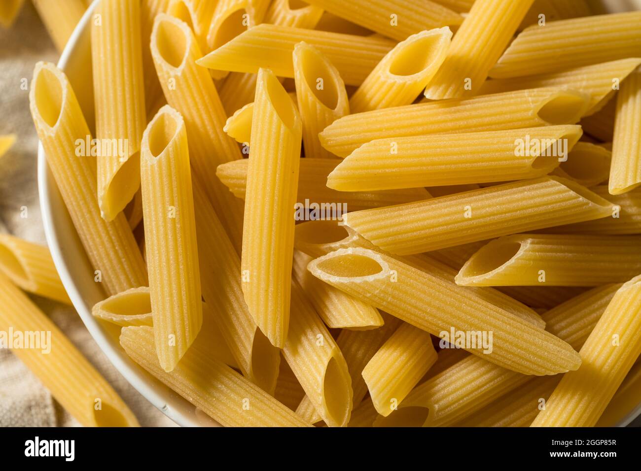 Homemade Raw Dry Penne Pasta in a Bowl Stock Photo - Alamy
