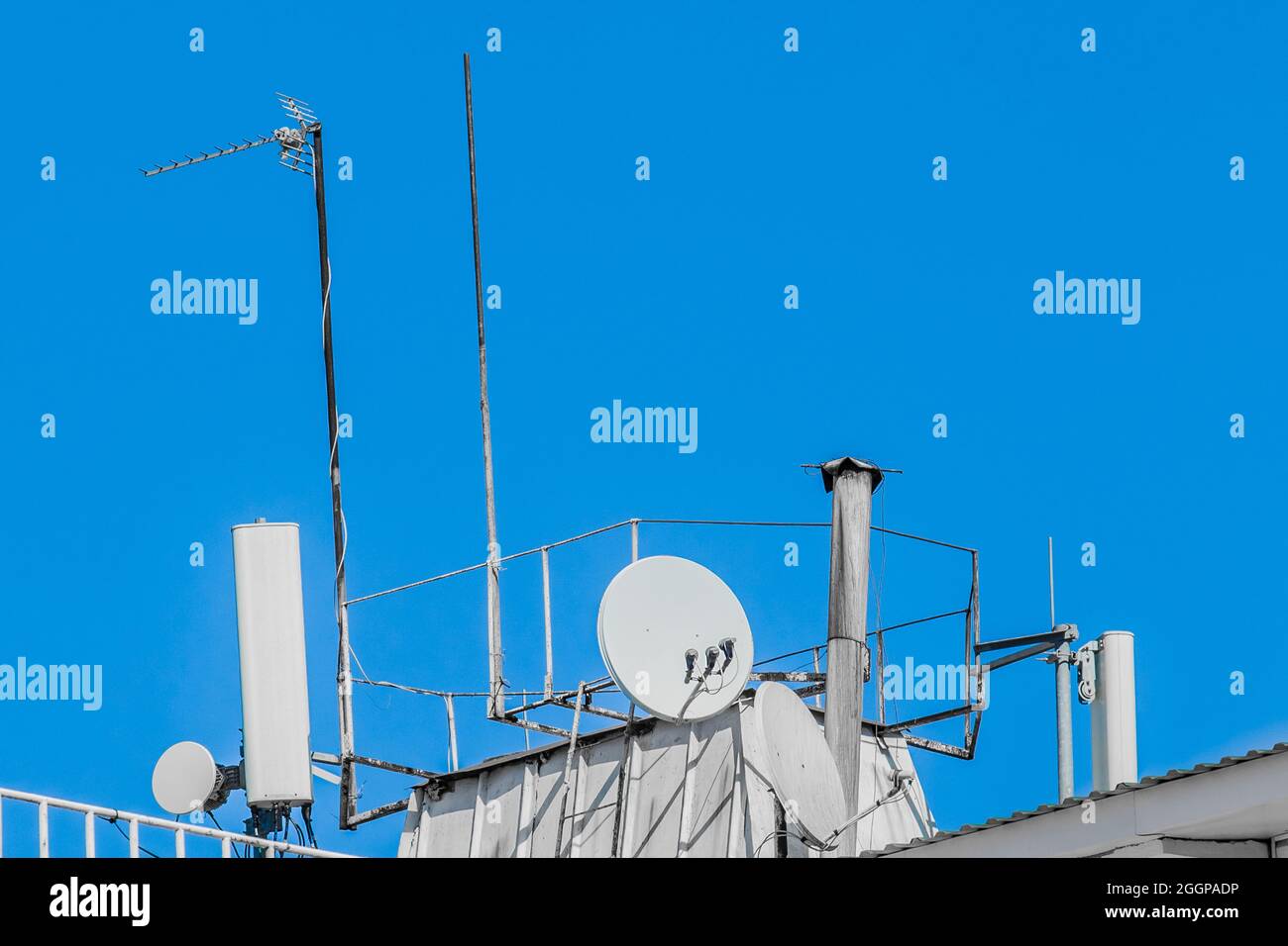 TV and mobile signal old system of technologies on the roof of the ...