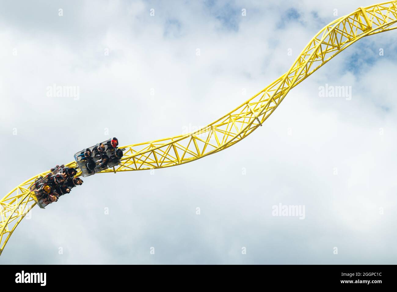 Ride roller coaster in motion in amusement park Stock Photo - Alamy