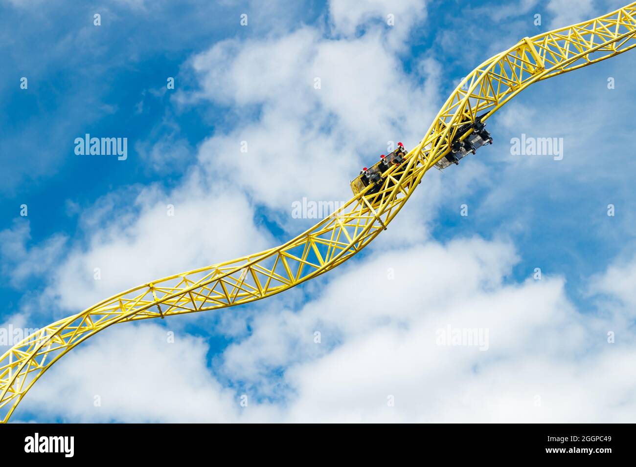 Ride roller coaster in motion in amusement park Stock Photo - Alamy