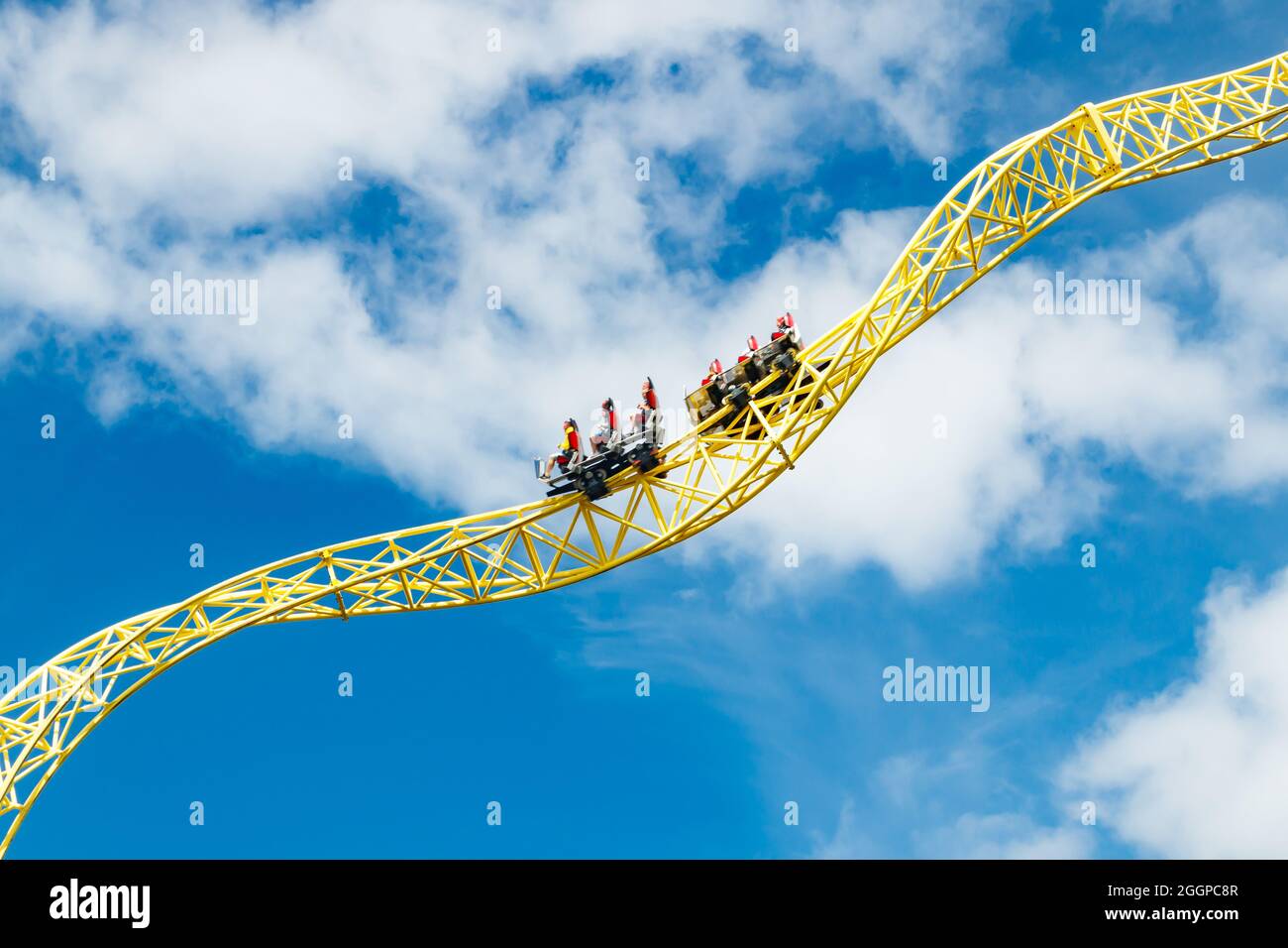 Ride roller coaster in motion in amusement park Stock Photo - Alamy