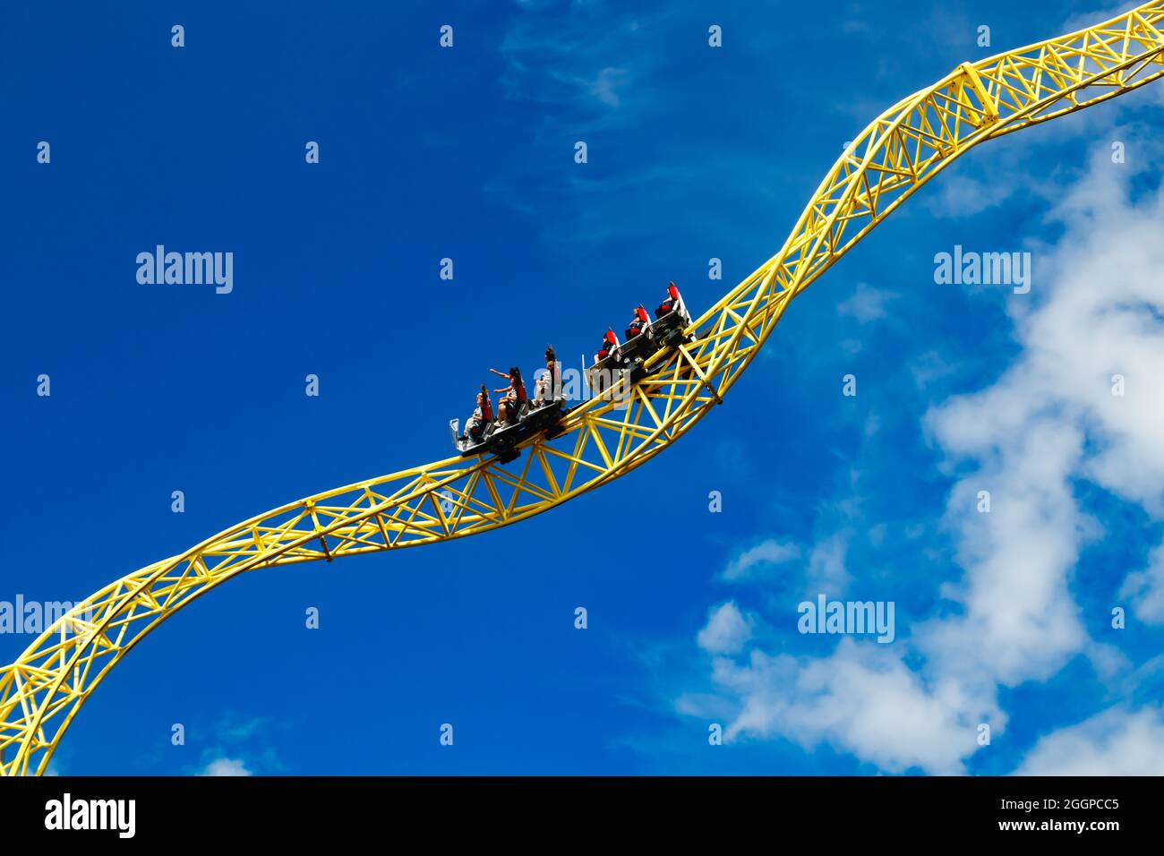 Ride roller coaster in motion in amusement park Stock Photo - Alamy