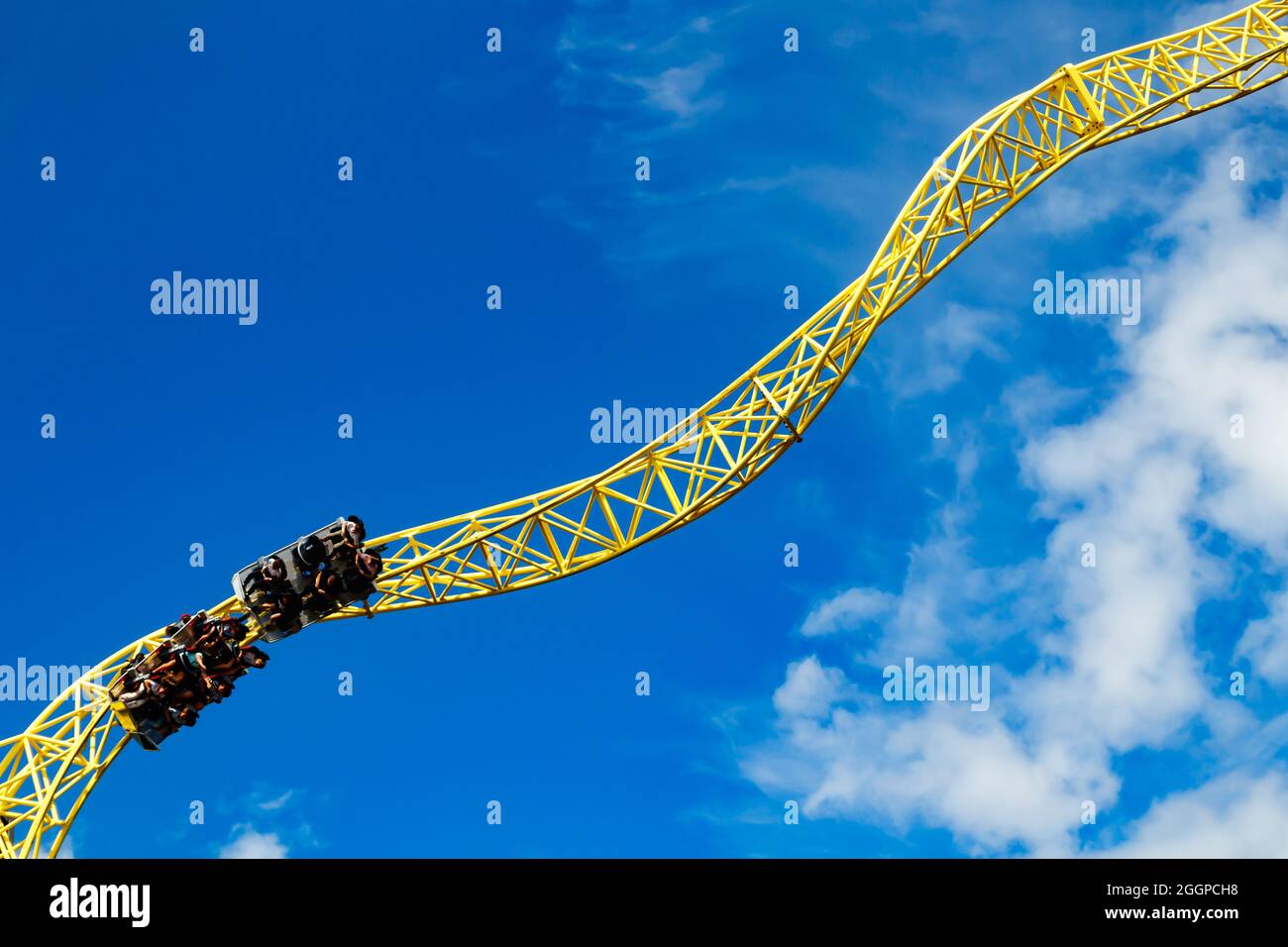 Ride roller coaster in motion in amusement park Stock Photo - Alamy