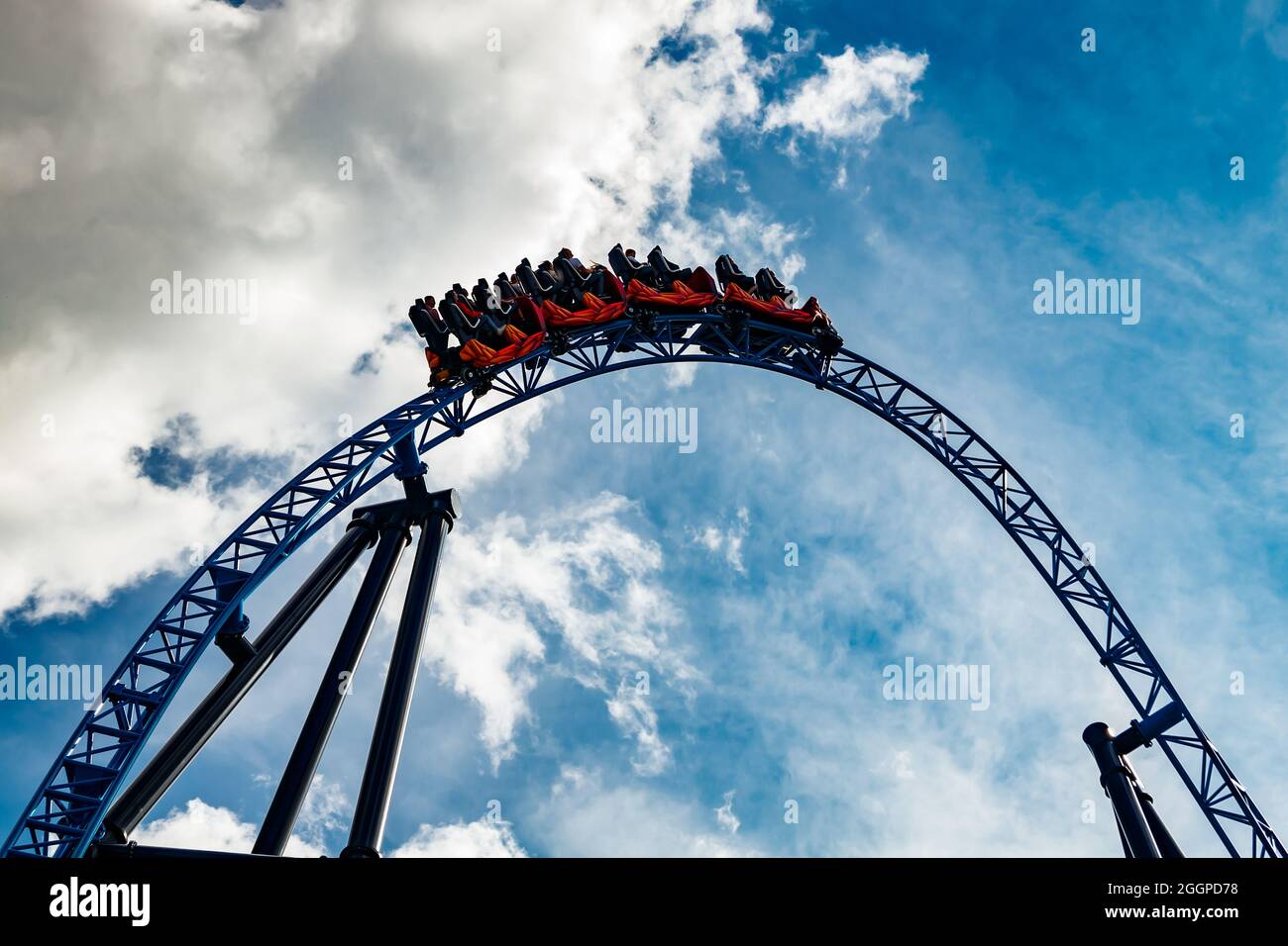 Ride roller coaster in motion in amusement park Stock Photo - Alamy