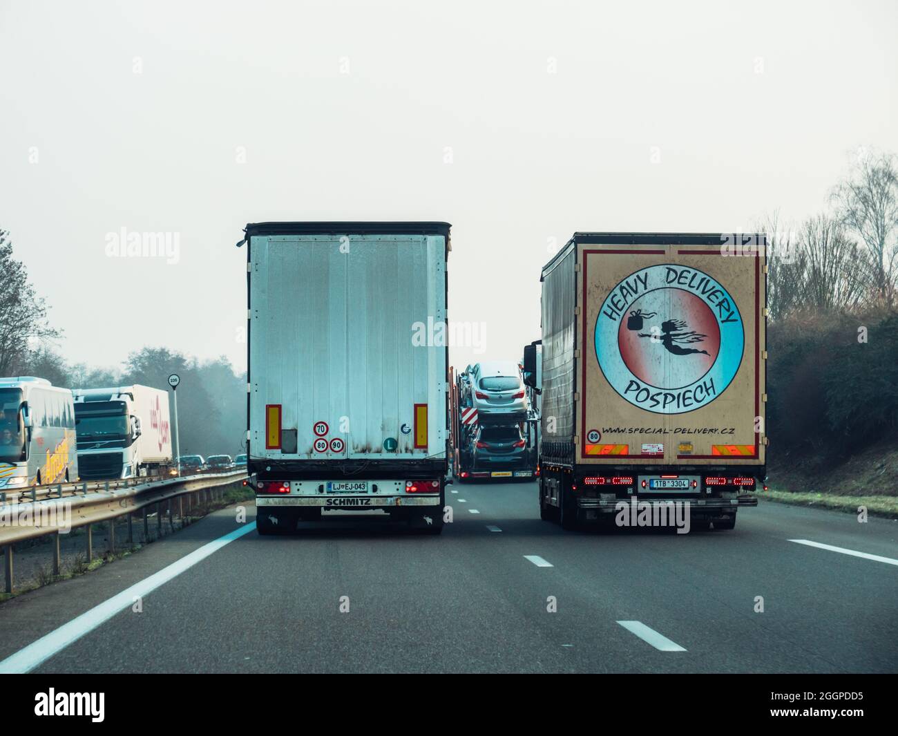 Rear view of long cargo trucks on French highways Stock Photo - Alamy