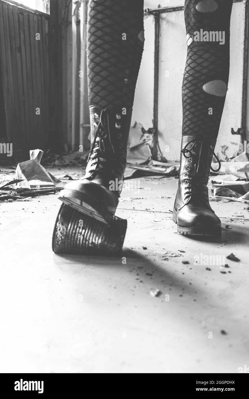 Grayscale of a woman's feet rolling an object Stock Photo - Alamy