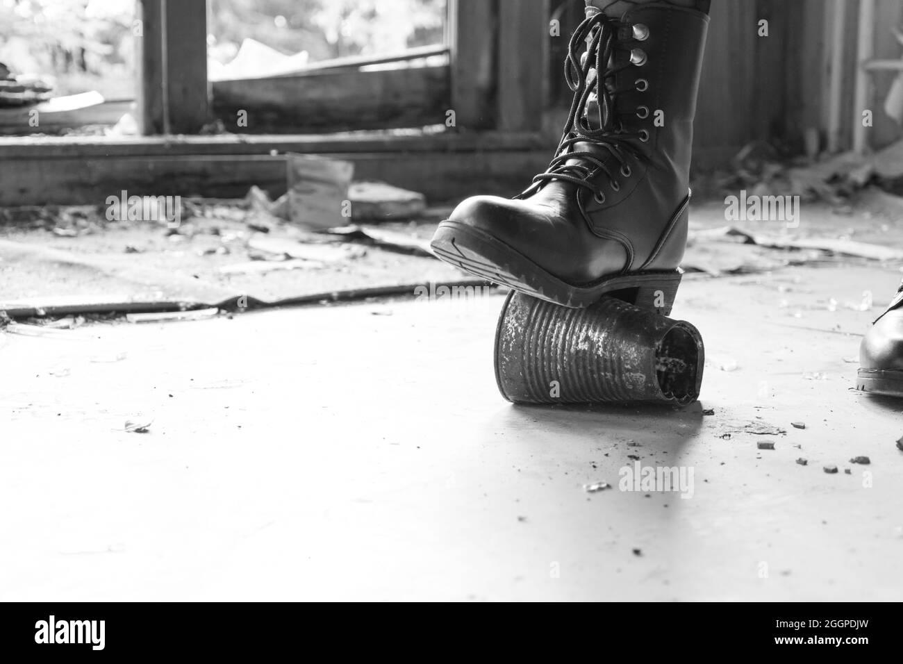 Grayscale of a woman's feet rolling an object Stock Photo - Alamy