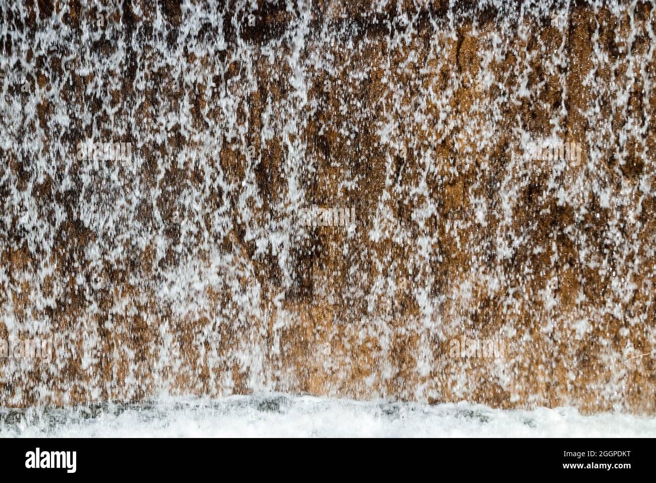 Texture of a flowing waterfall on the wall Stock Photo - Alamy