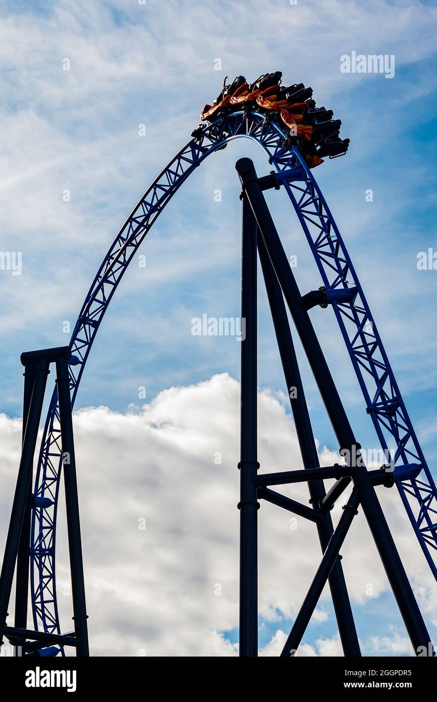 Ride roller coaster in motion in amusement park Stock Photo - Alamy
