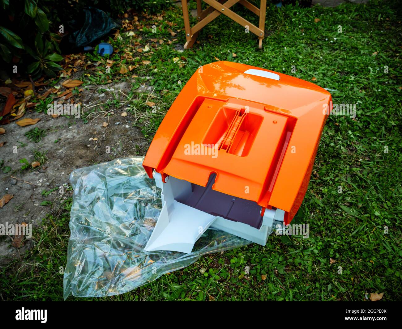 unboxing orange lawnmower 55 Liters grass collection box Stock Photo ...