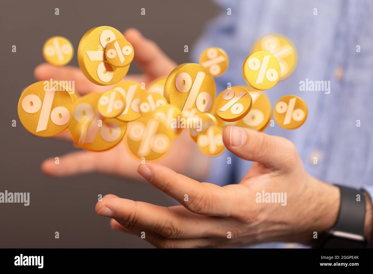 3D rate/percent signs between a male's hands Stock Photo - Alamy
