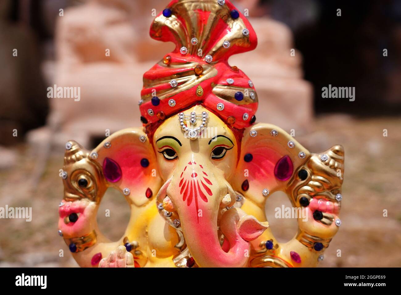 Indian Artisan works on an idol of the elephant-headed Hindu god Lord ...