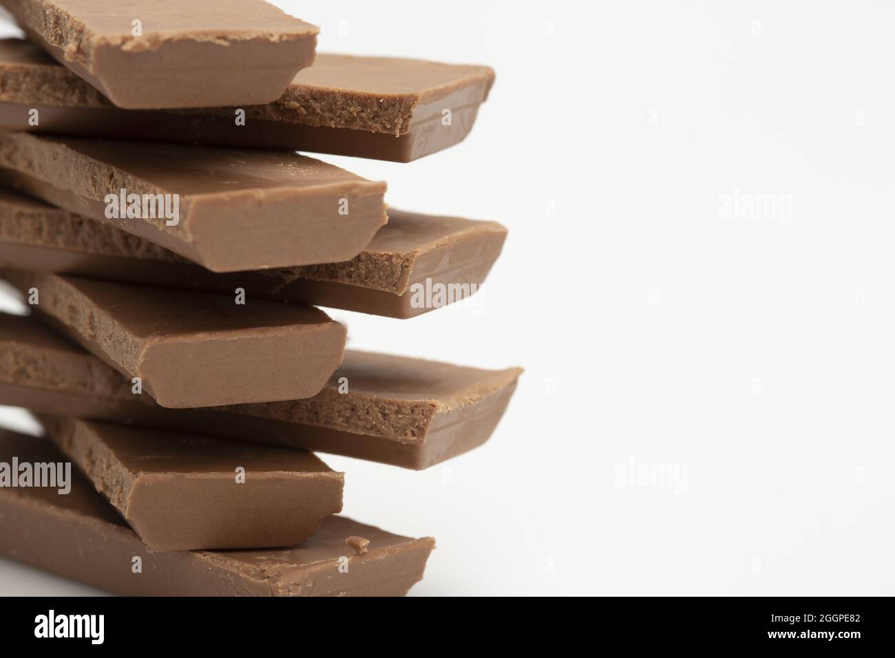 Wooden objects stacked on each other on the white surface Stock Photo ...