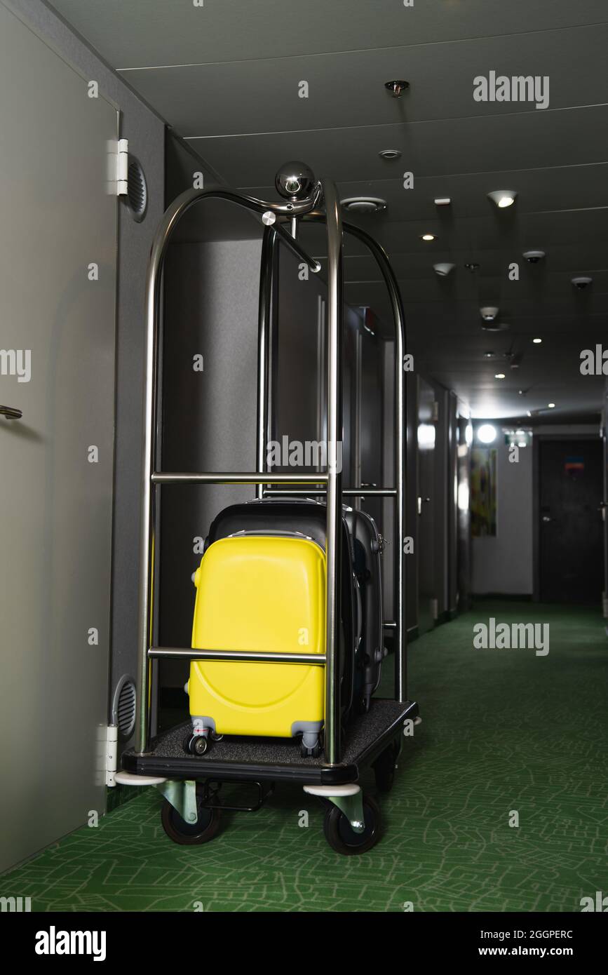 luggage on bell cart in hotel hall Stock Photo - Alamy