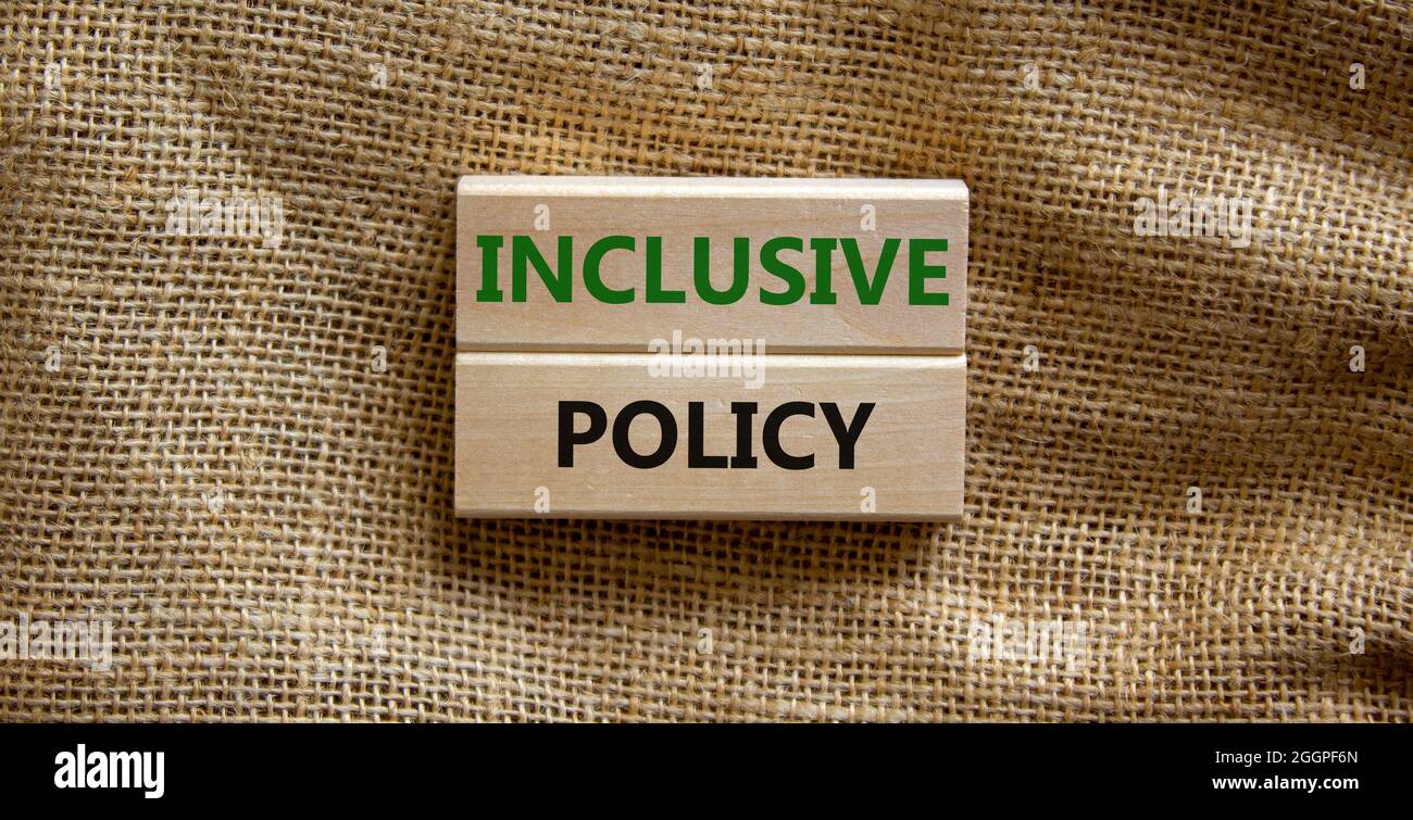 Inclusive policy symbol. Wooden blocks with words Inclusive policy on ...