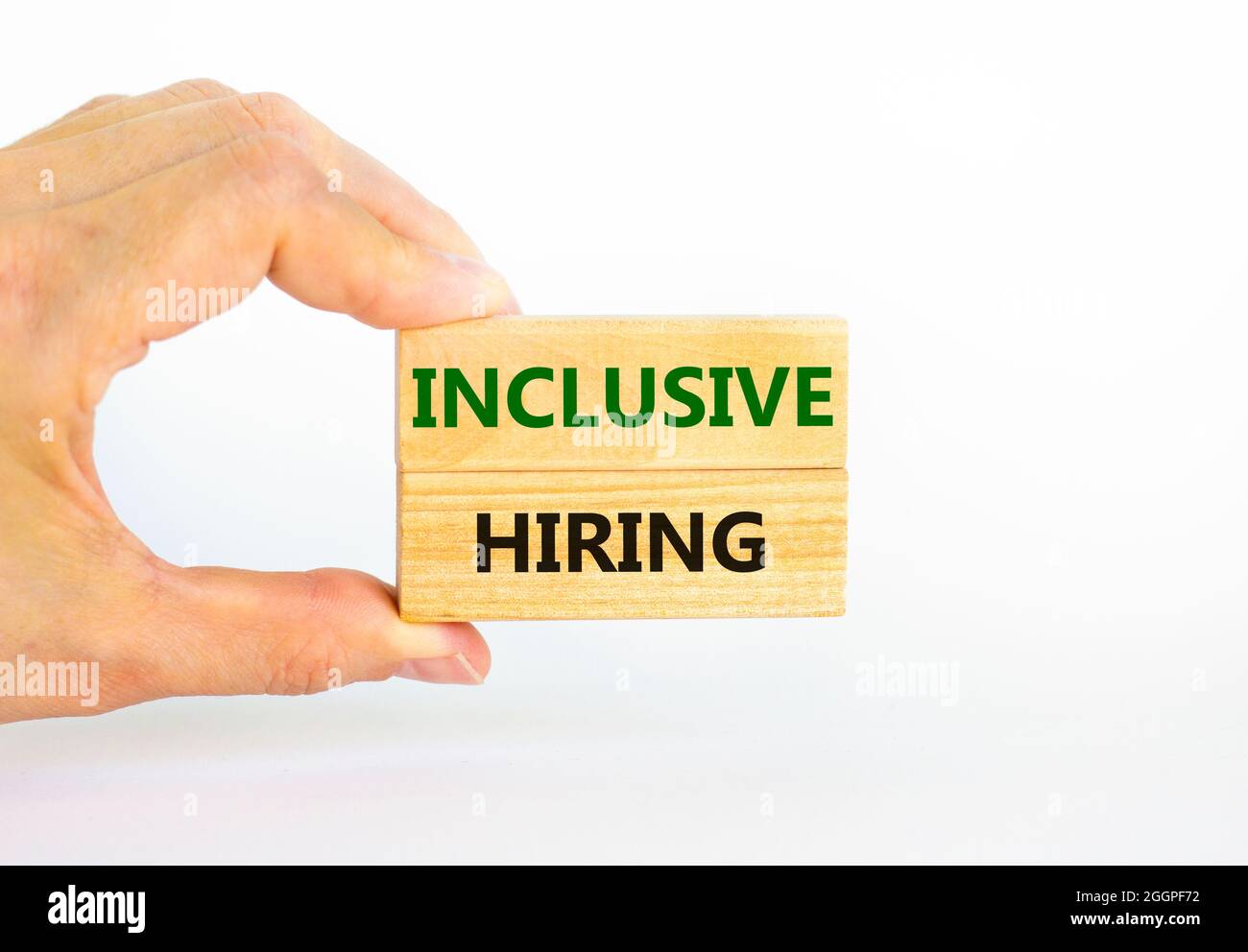 Inclusive hiring symbol. Wooden blocks with words Inclusive hiring on ...