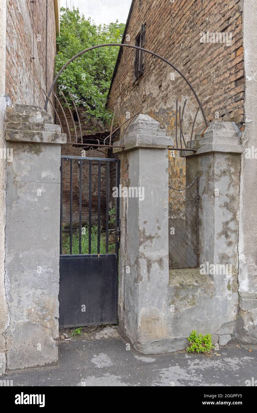 Small Yard Narrow Entrance Between Building Walls Stock Photo - Alamy