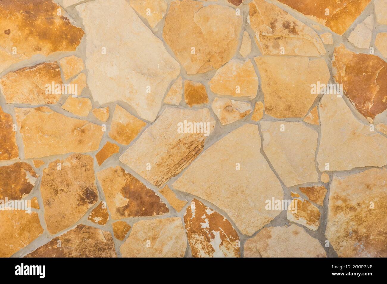 Light yellow and brown stone tile pattern wall surface texture ...