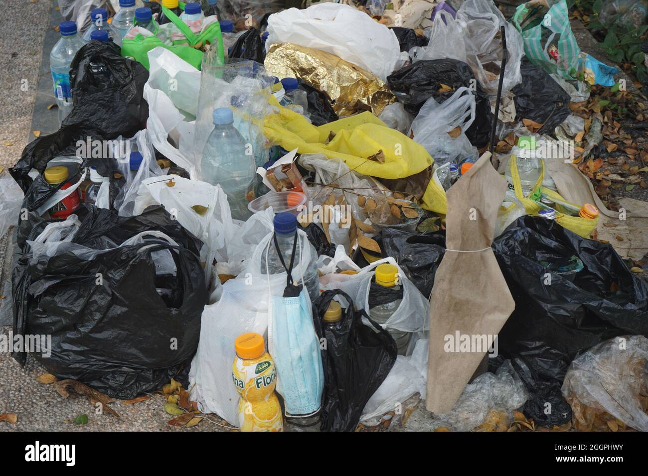 The garbage in the river with rock background Stock Photo - Alamy