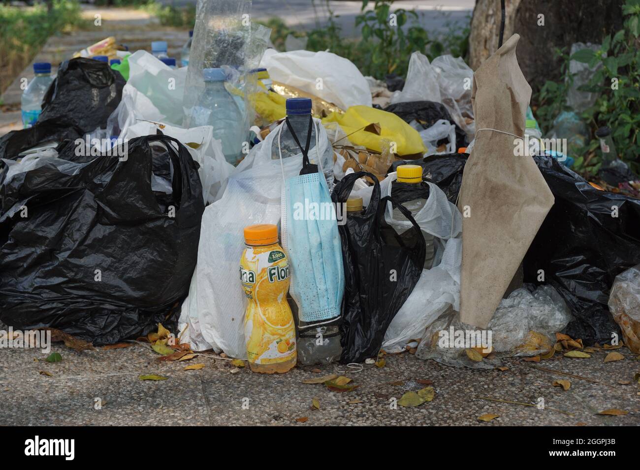 The garbage in the river with rock background Stock Photo - Alamy