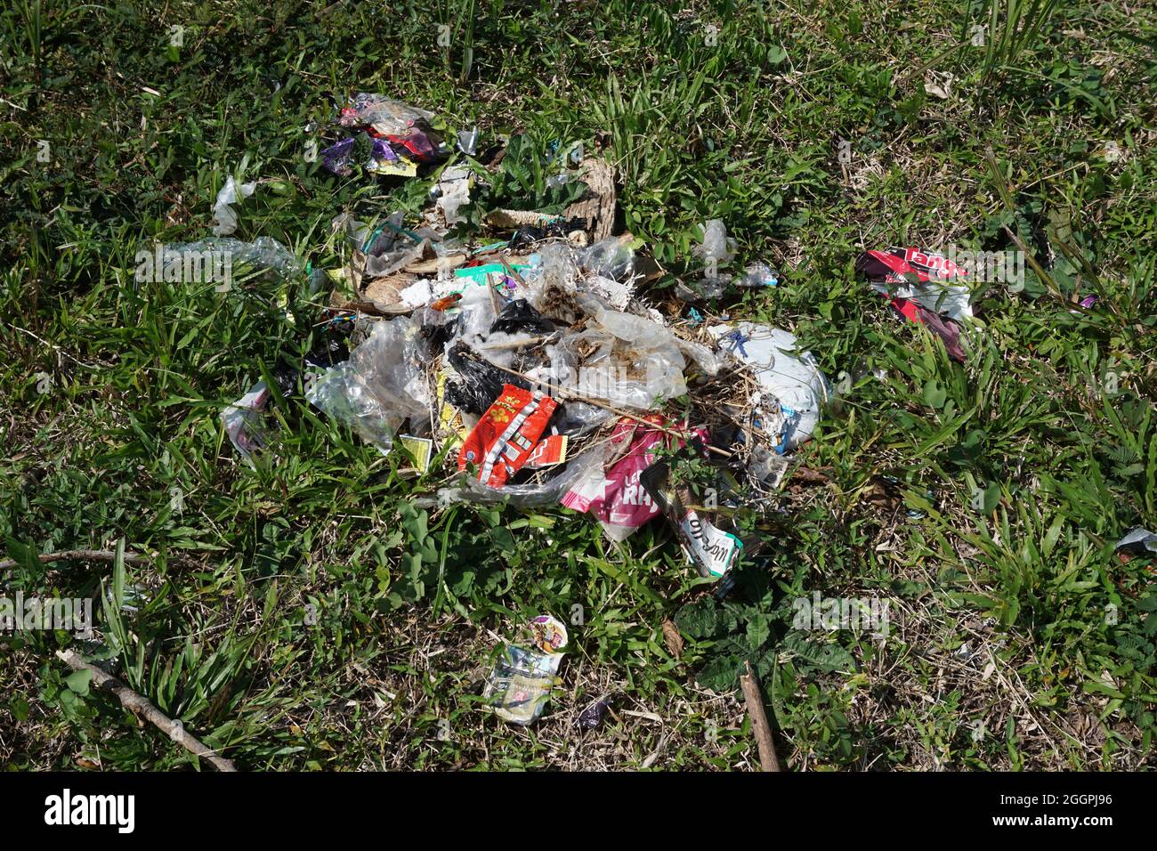 The garbage in the river with rock background Stock Photo - Alamy