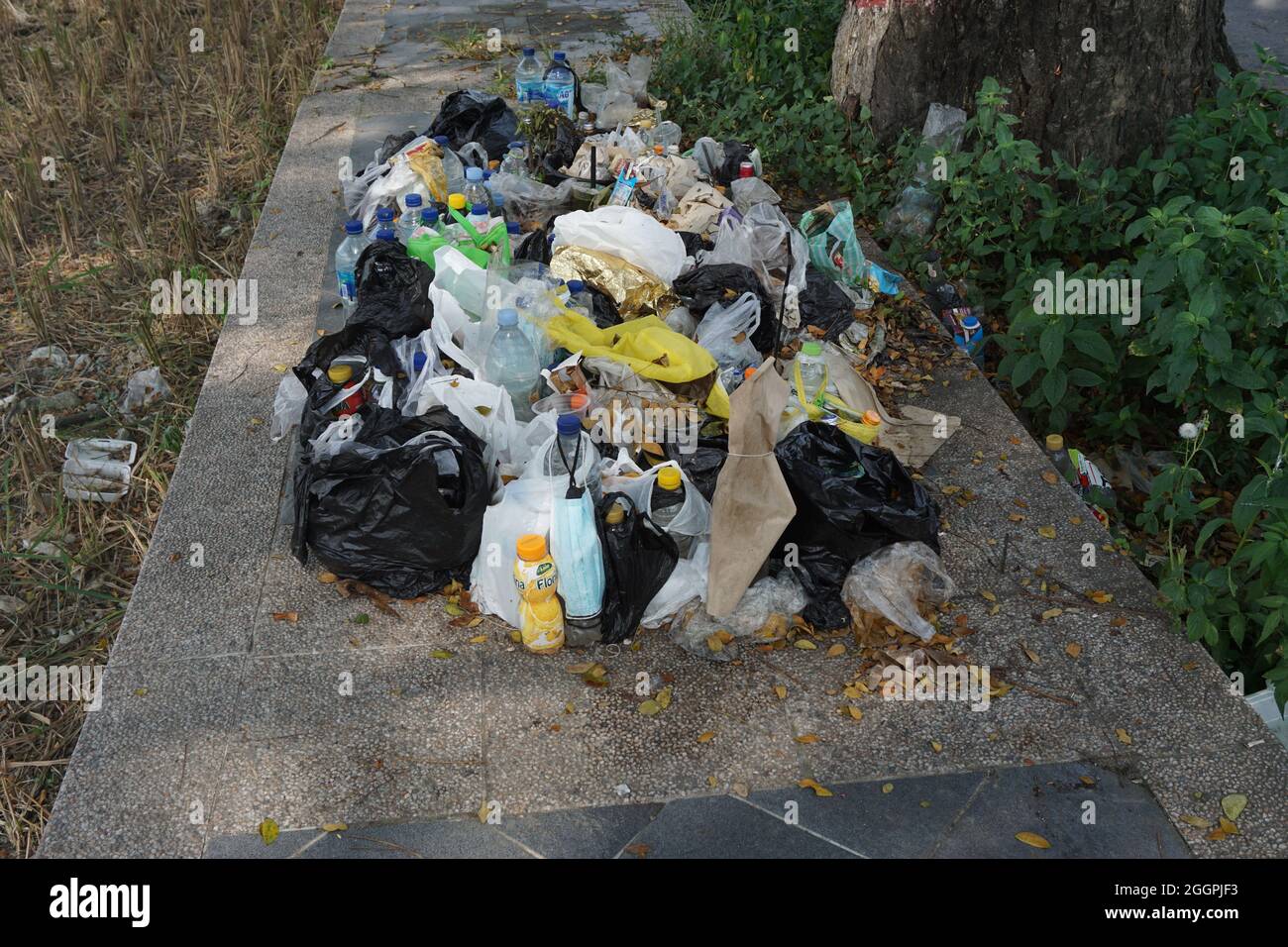 The garbage in the river with rock background Stock Photo - Alamy