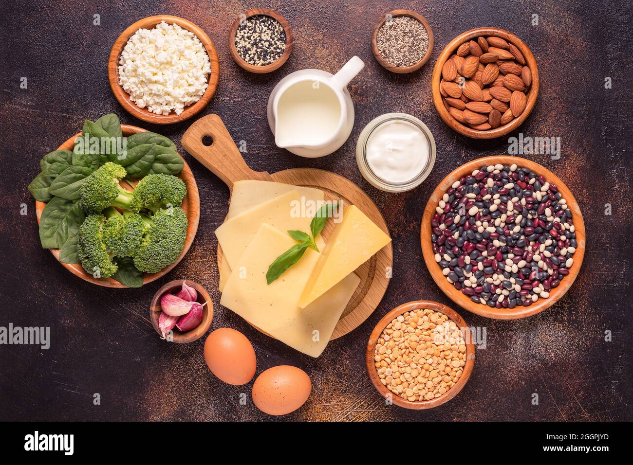 Products rich in calcium on dark background. Healthy food. Top view ...