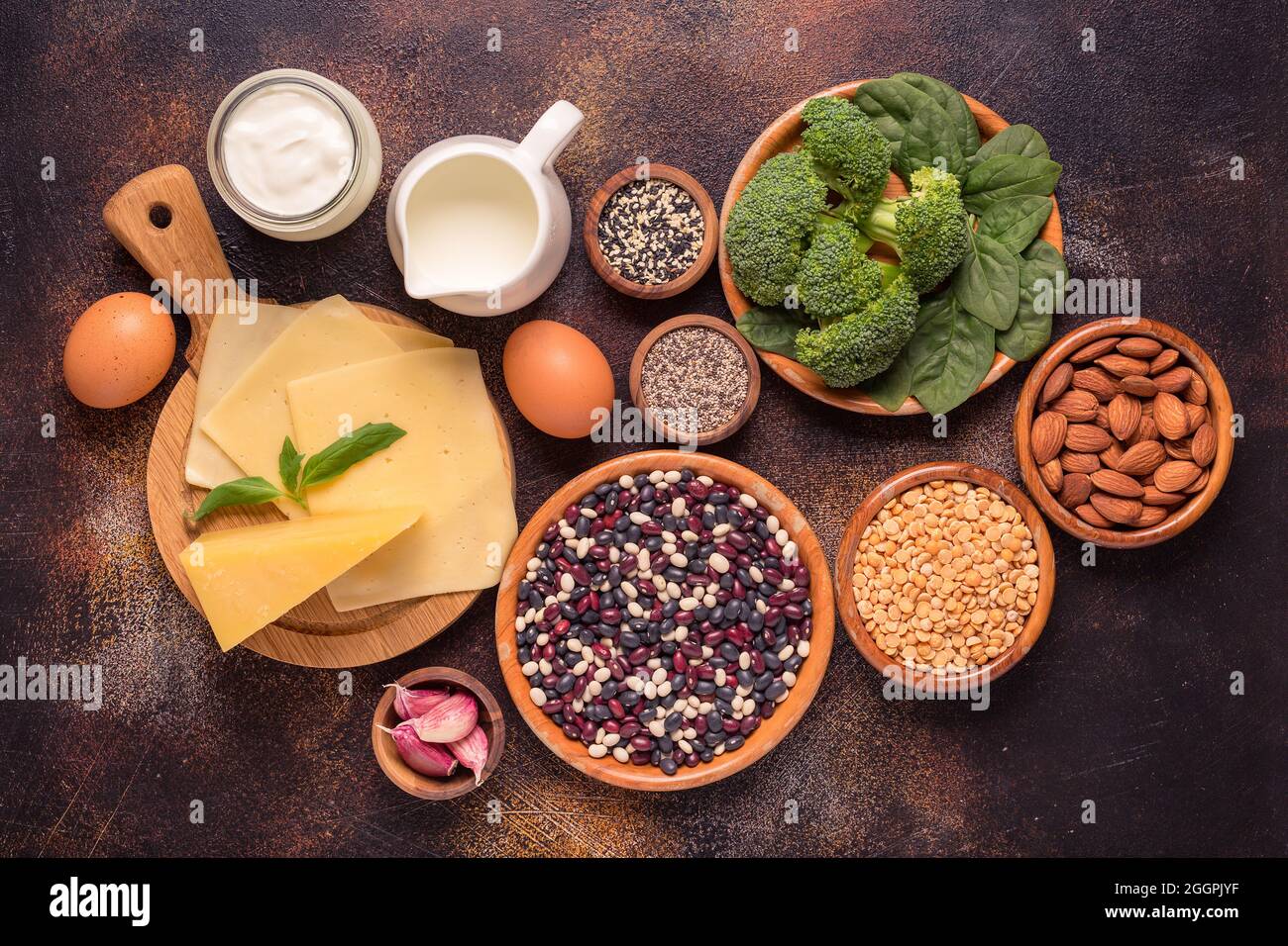 Products rich in calcium on dark background. Healthy food. Top view ...