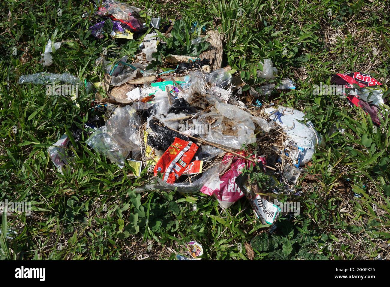 The garbage in the river with rock background Stock Photo - Alamy