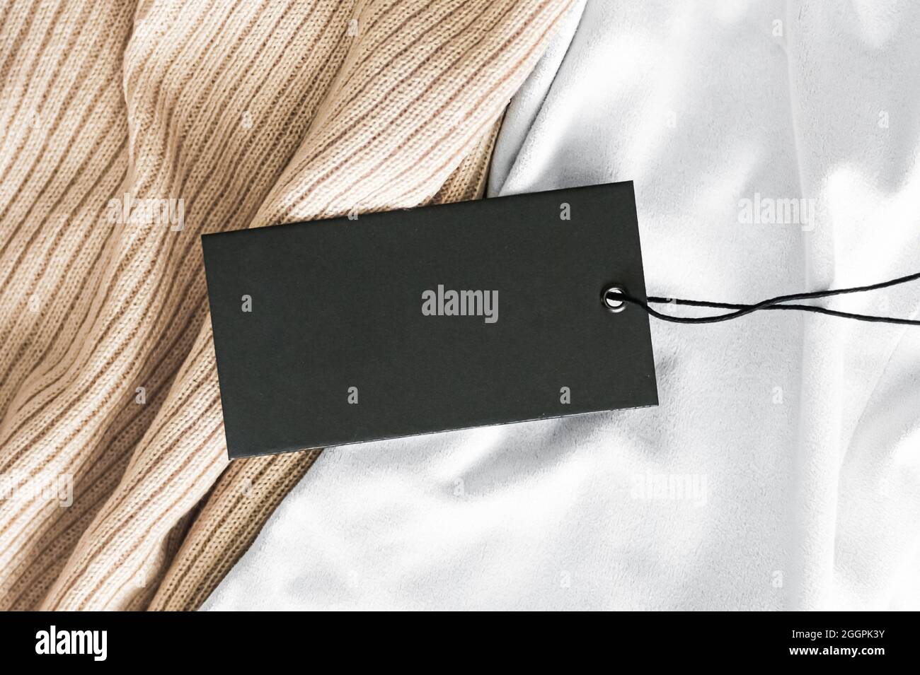 Black horizontal price tag on luxury fabric background Stock Photo - Alamy