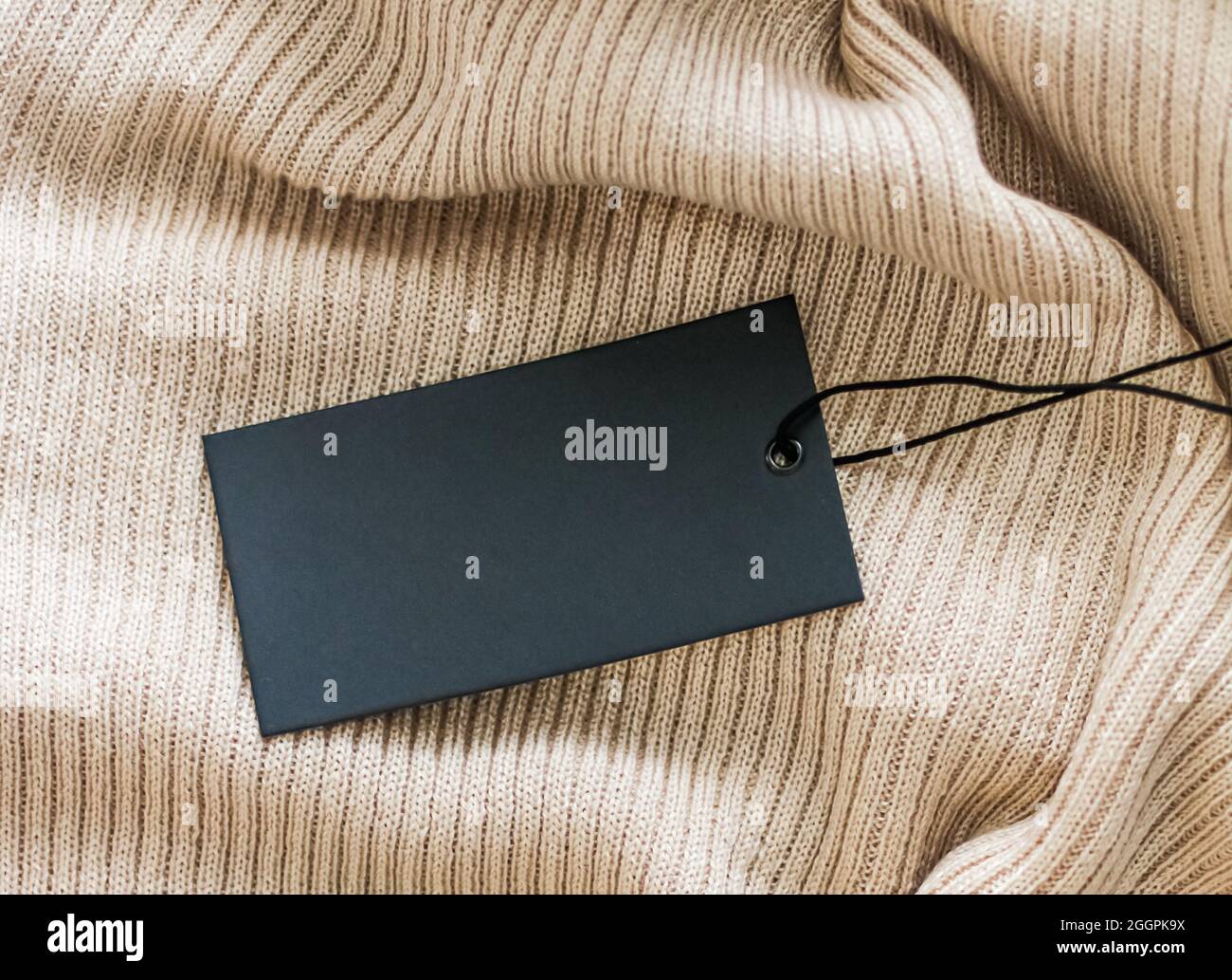 Blank black price tag for luxury fashion brand Stock Photo - Alamy