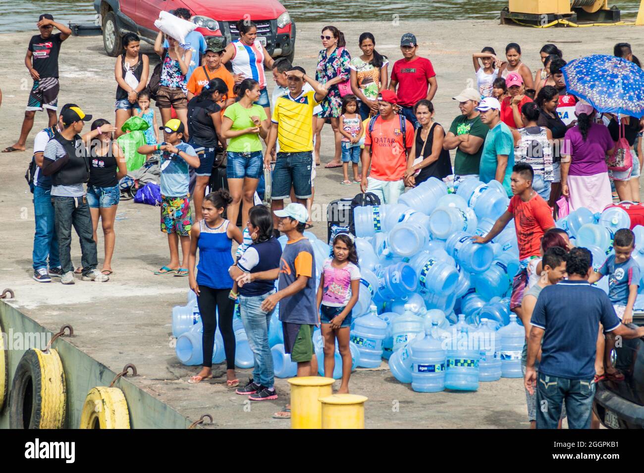 TONANTINS, BRAZIL - JUNE 23, 2015: Pople waiting at a pier at the river ...
