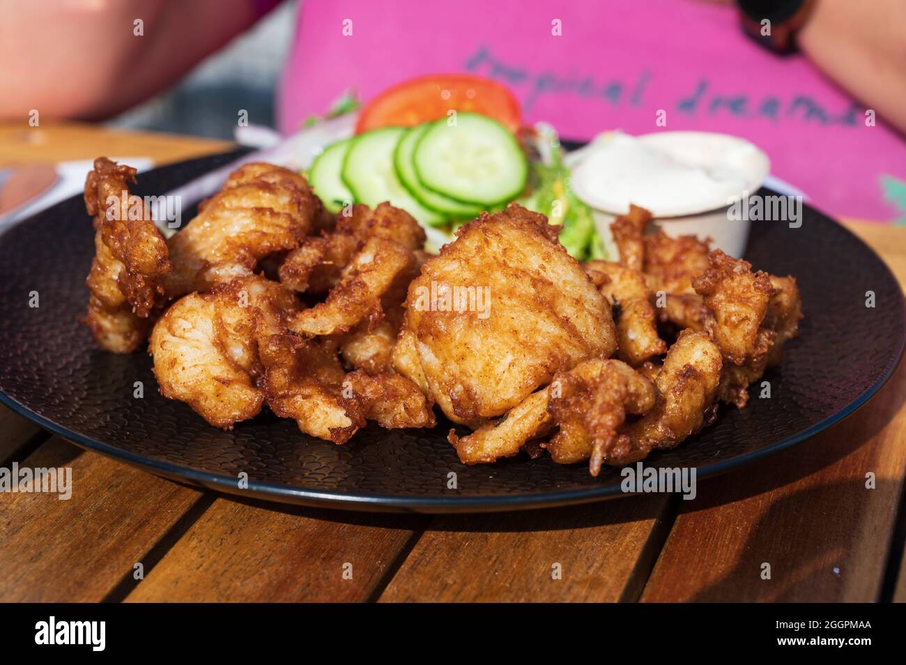 Dutch street food, fried pieces of cod fish fillet served with garlic ...